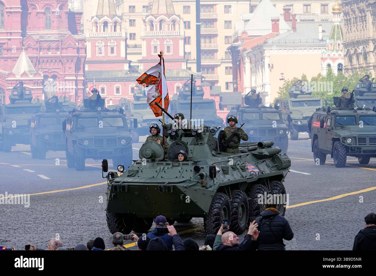 Russian servicemen ride atop the APC along Red Square during the ...