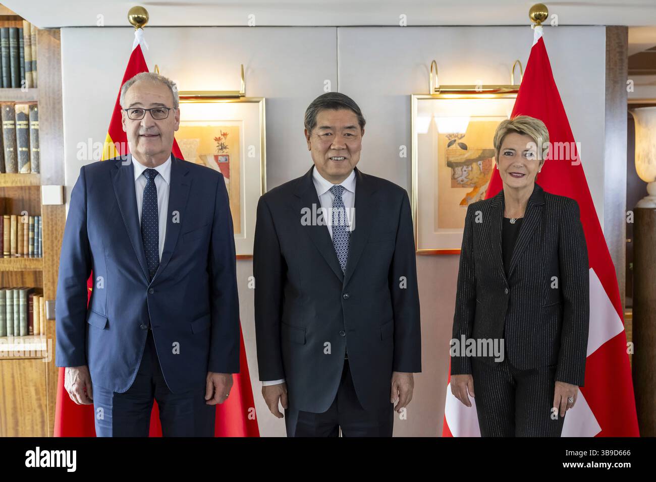 Switzerland's Economy Minister Federal Councillor Guy Parmelin, left, Chinese Vice Premier He ...