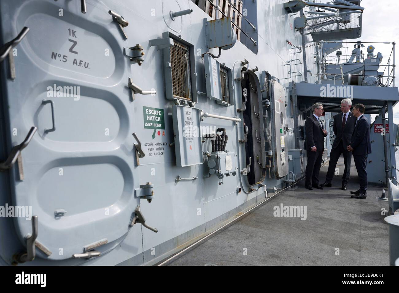 Britain's Prime Minister Keir Starmer speaks to Charles Woodburn CEO of ...