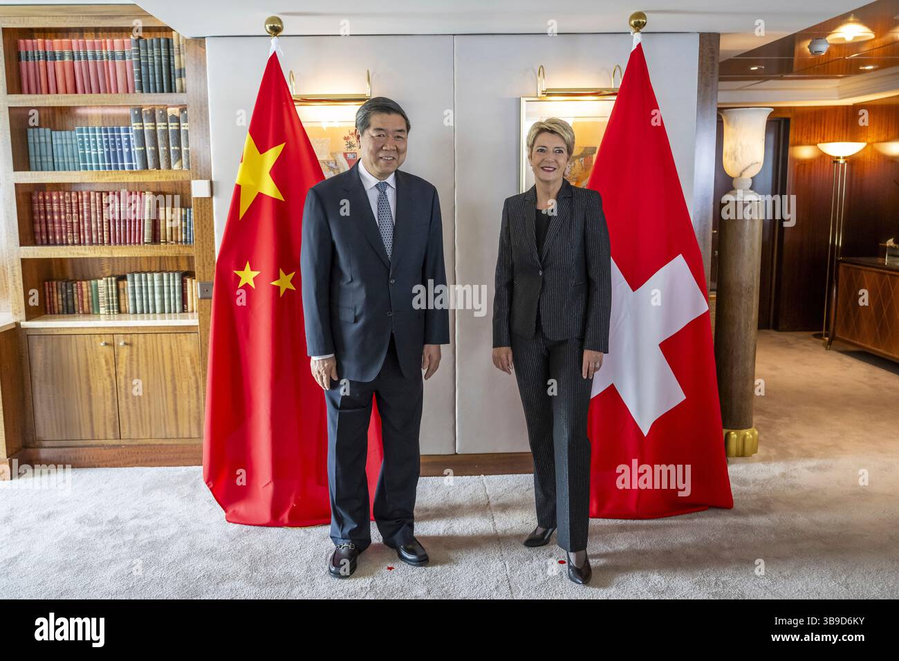 Chinese Vice Premier He Lifeng, left, and Switzerland's President Karin Keller-Sutter, right ...
