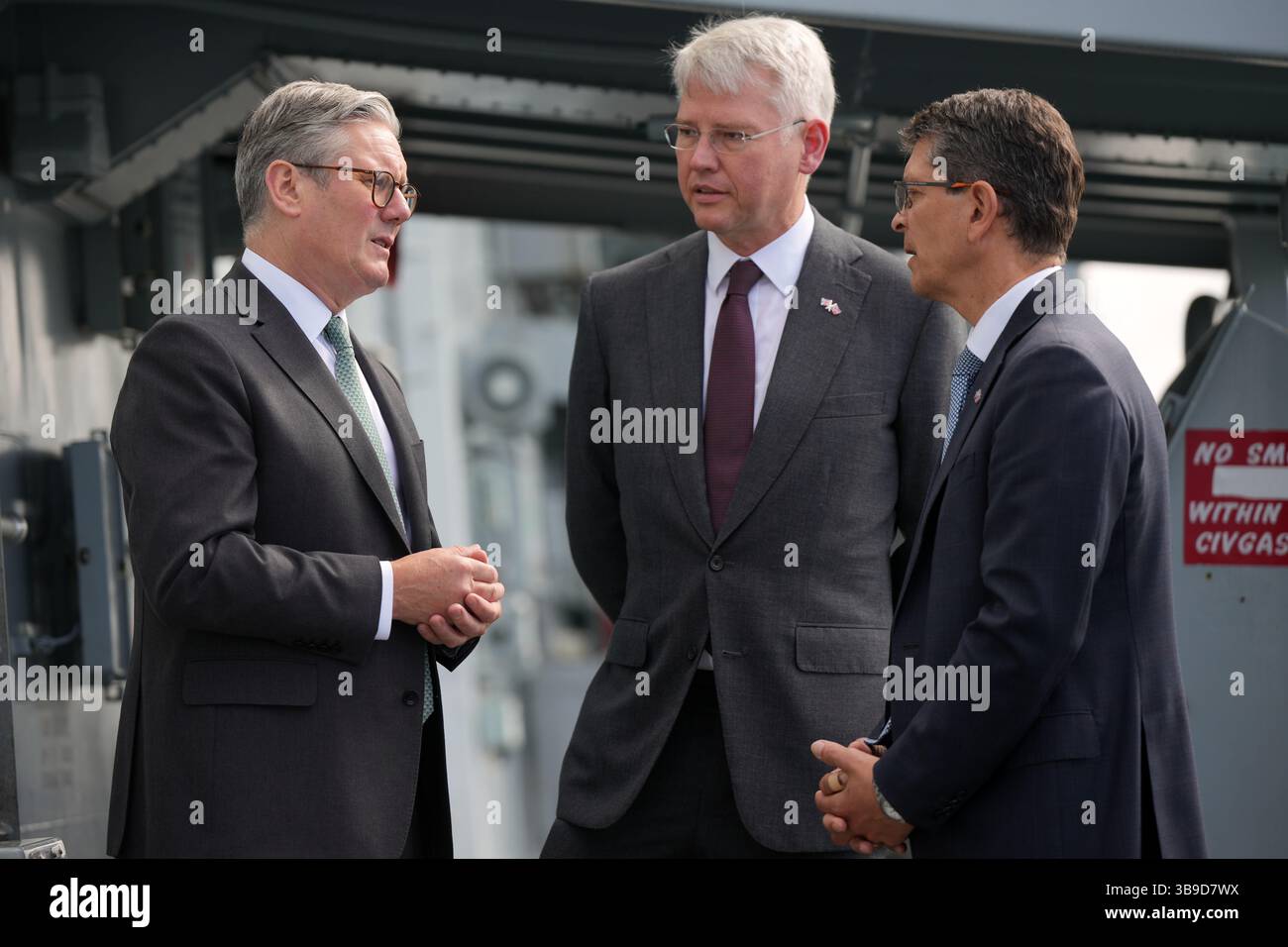 Prime Minister Sir Keir Starmer (left) speaks to Charles Woodburn CEO ...