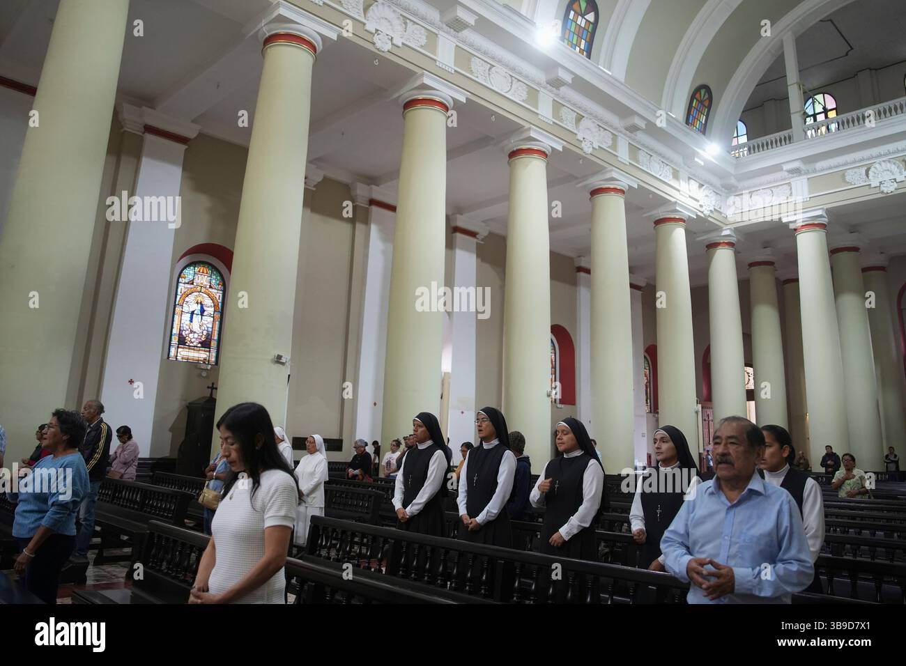 Parishioners and nuns pray during morning Mass at the Santa Maria ...