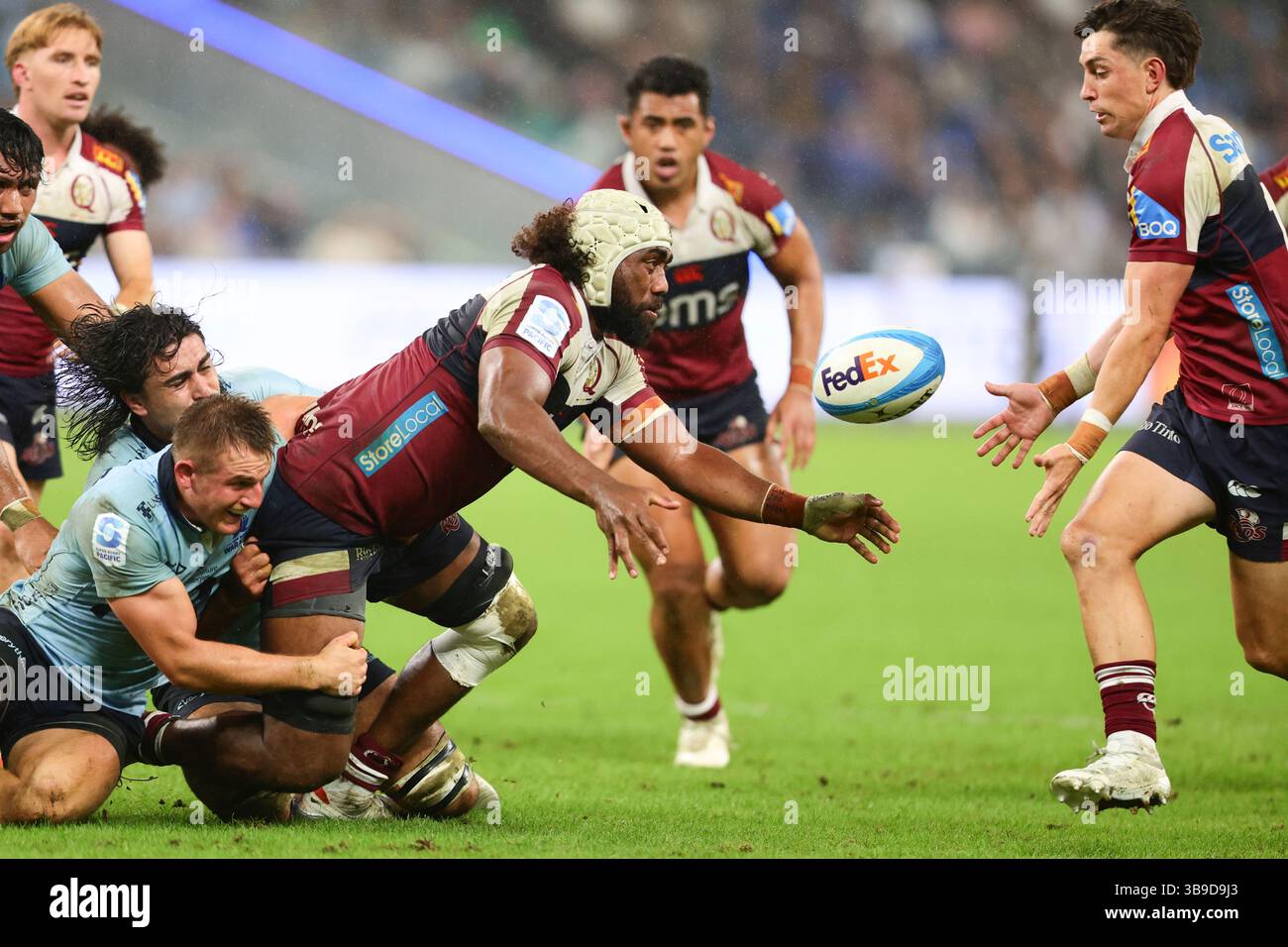 SYDNEY, AUSTRALIA - MAY 09: Seru Uru of Queensland Reds passes the ball ...