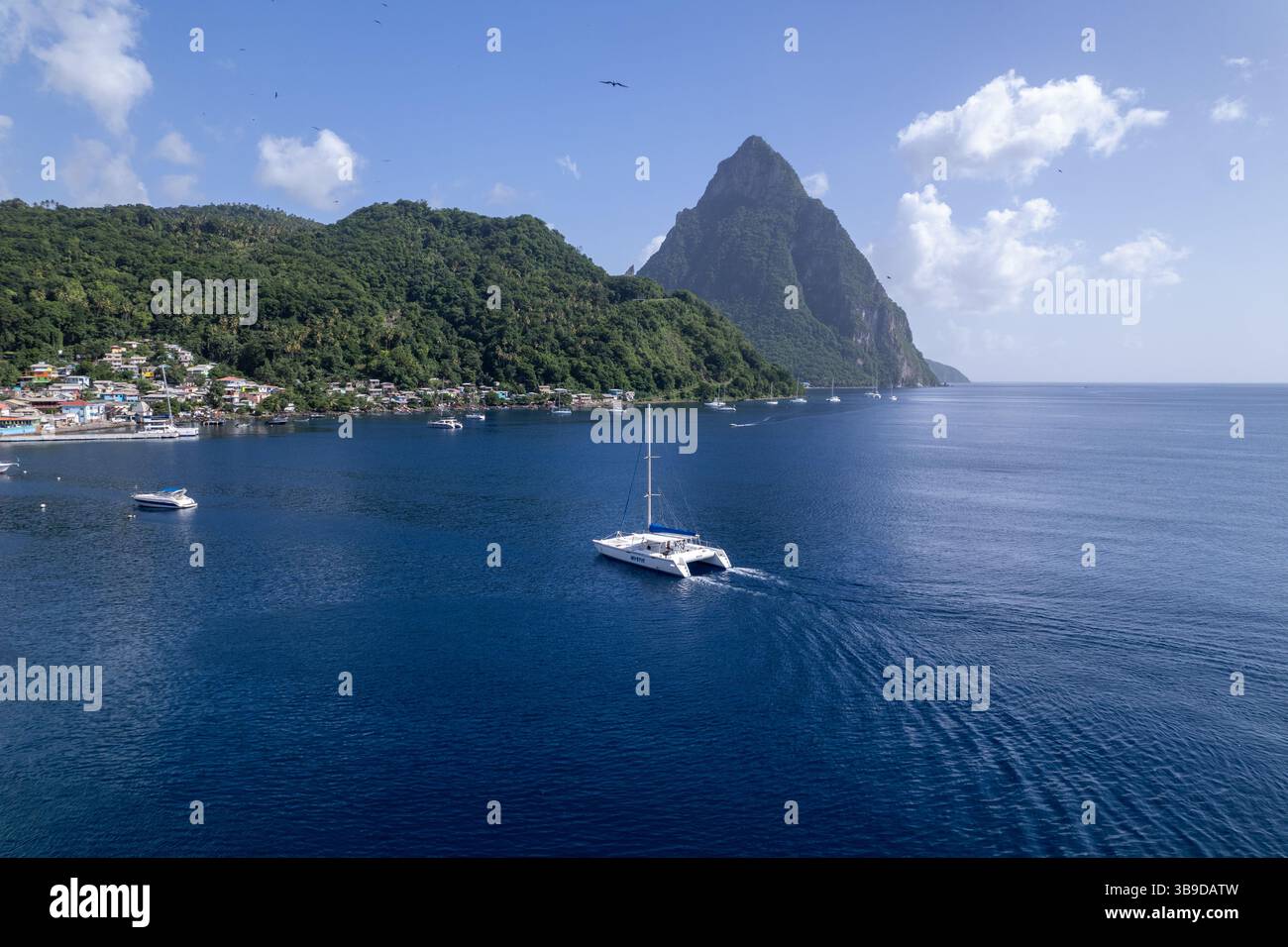 Aerial of boat in Soufriere Bay with Gros Piton and Petit Piton on St ...