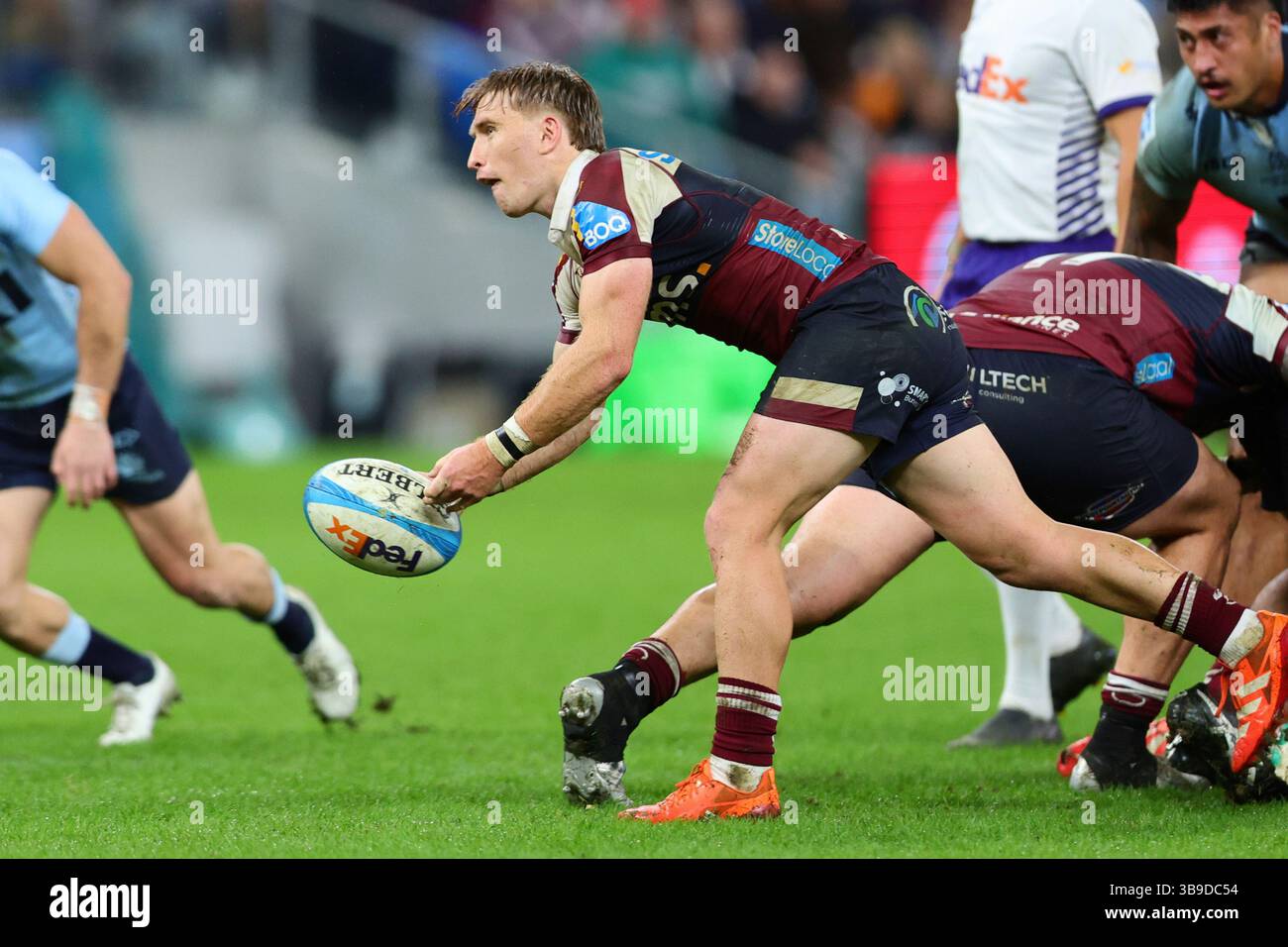 SYDNEY, AUSTRALIA - MAY 09: Tate McDermott of Queensland Reds passes ...