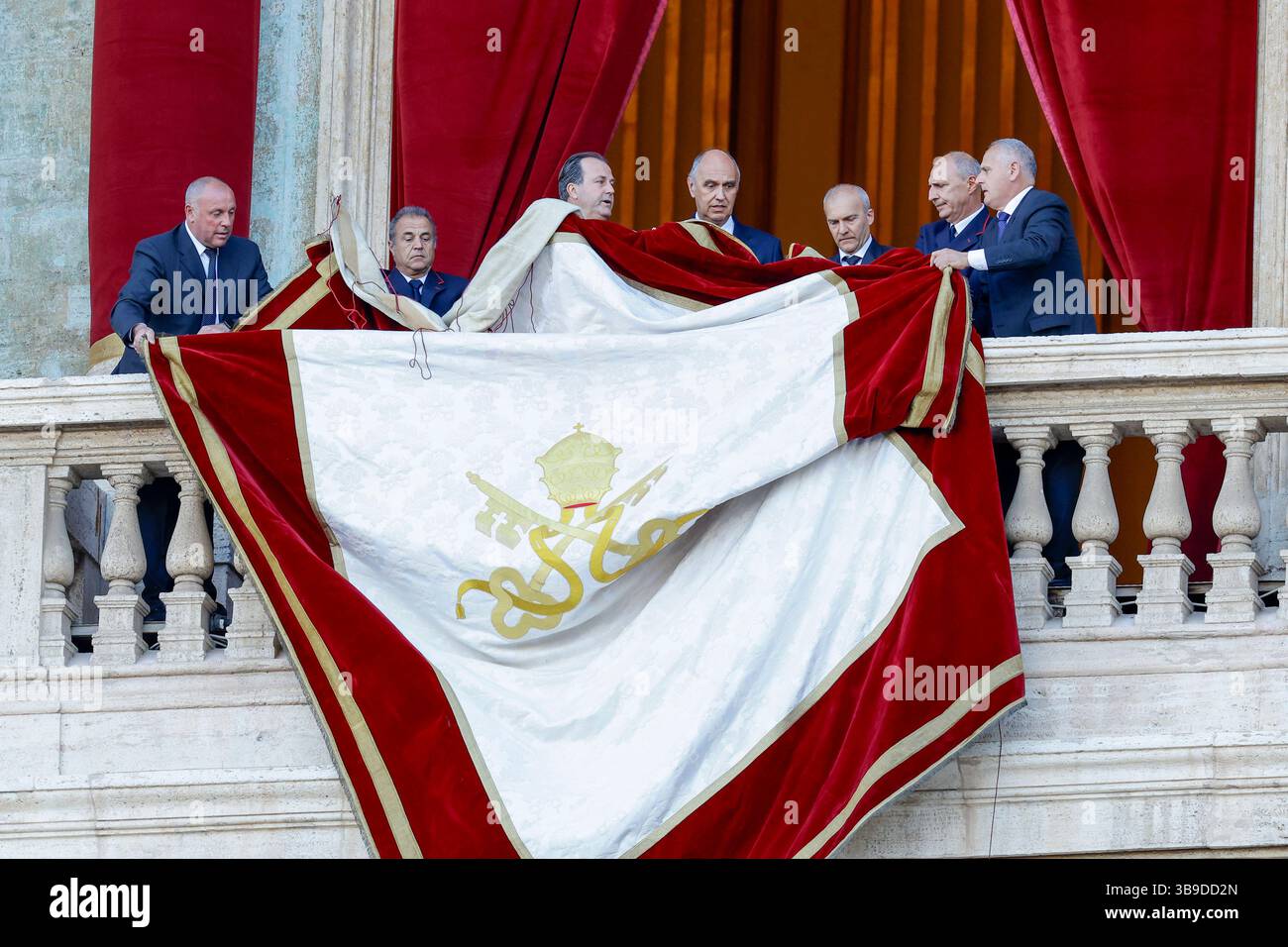 Cardinals react from a balcony of the St Peter's Basilica, as the new ...