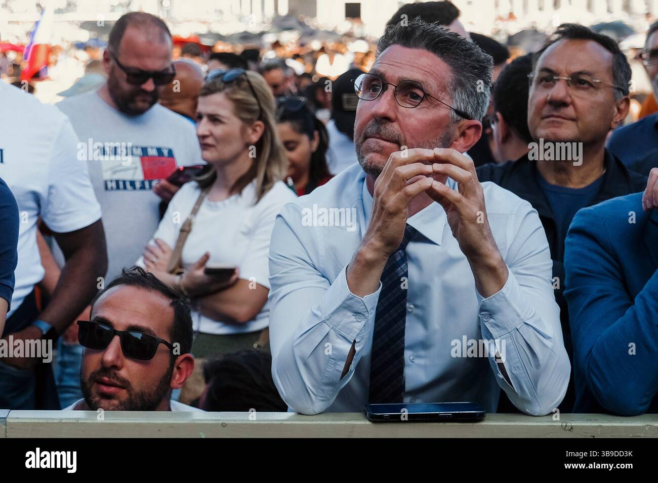 people in st. peter's square watch the chimney of the sistine chapel ...