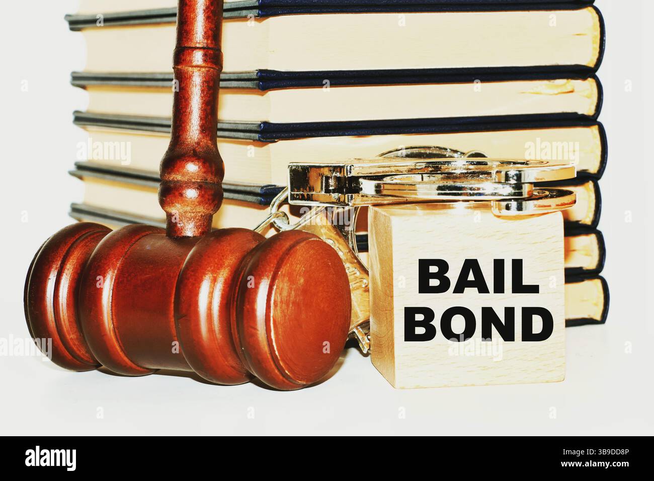 Bail Bond message with handcuffs books and gavel Stock Photo - Alamy