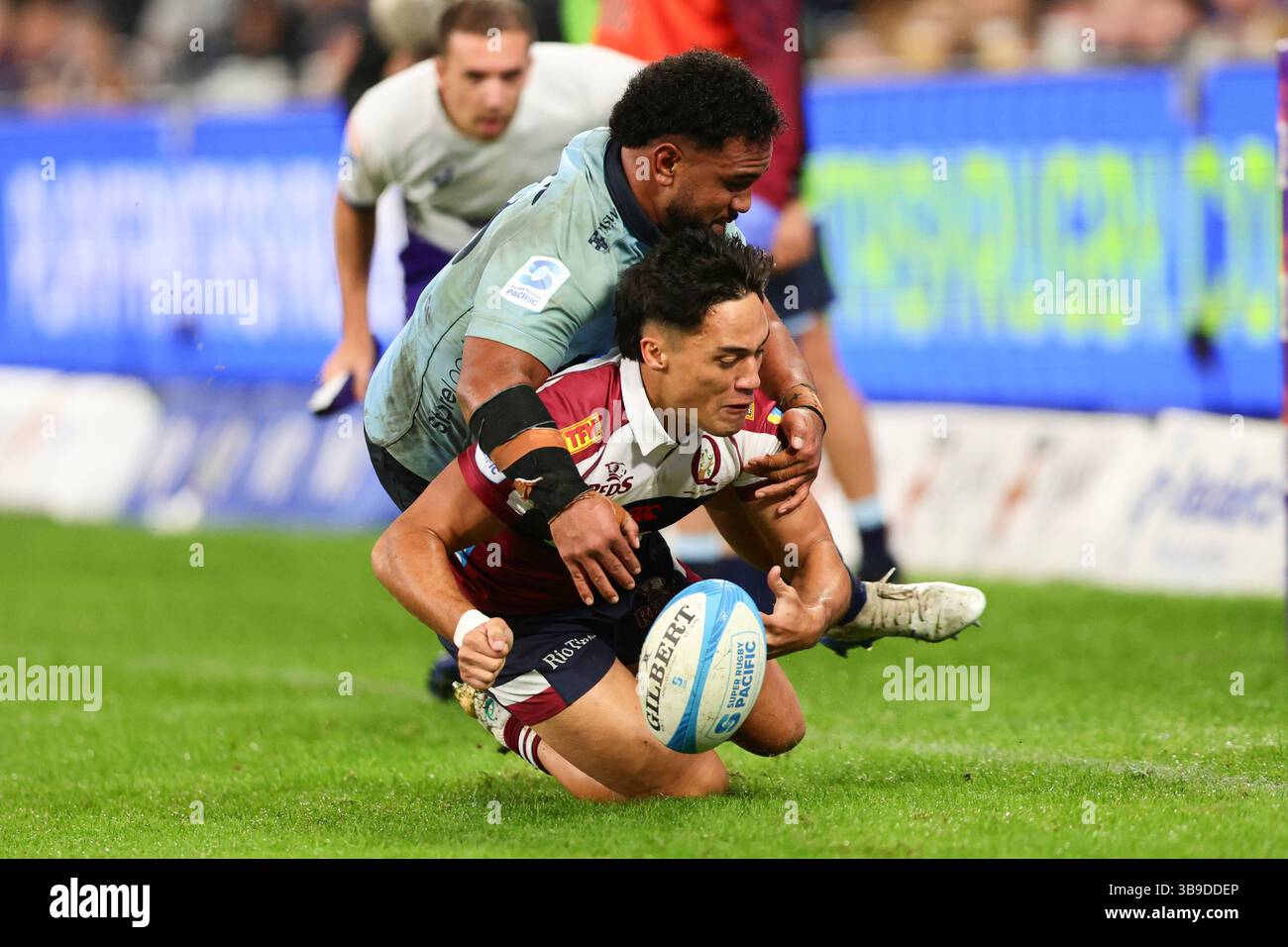 SYDNEY, AUSTRALIA - MAY 09: Kalani Thomas of Queensland Reds dives for ...