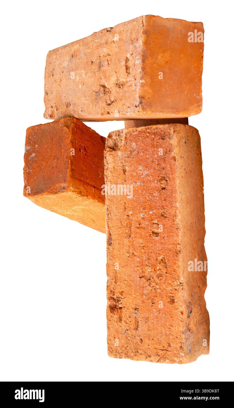 Side view of three old red or orange bricks in stack is isolated on ...