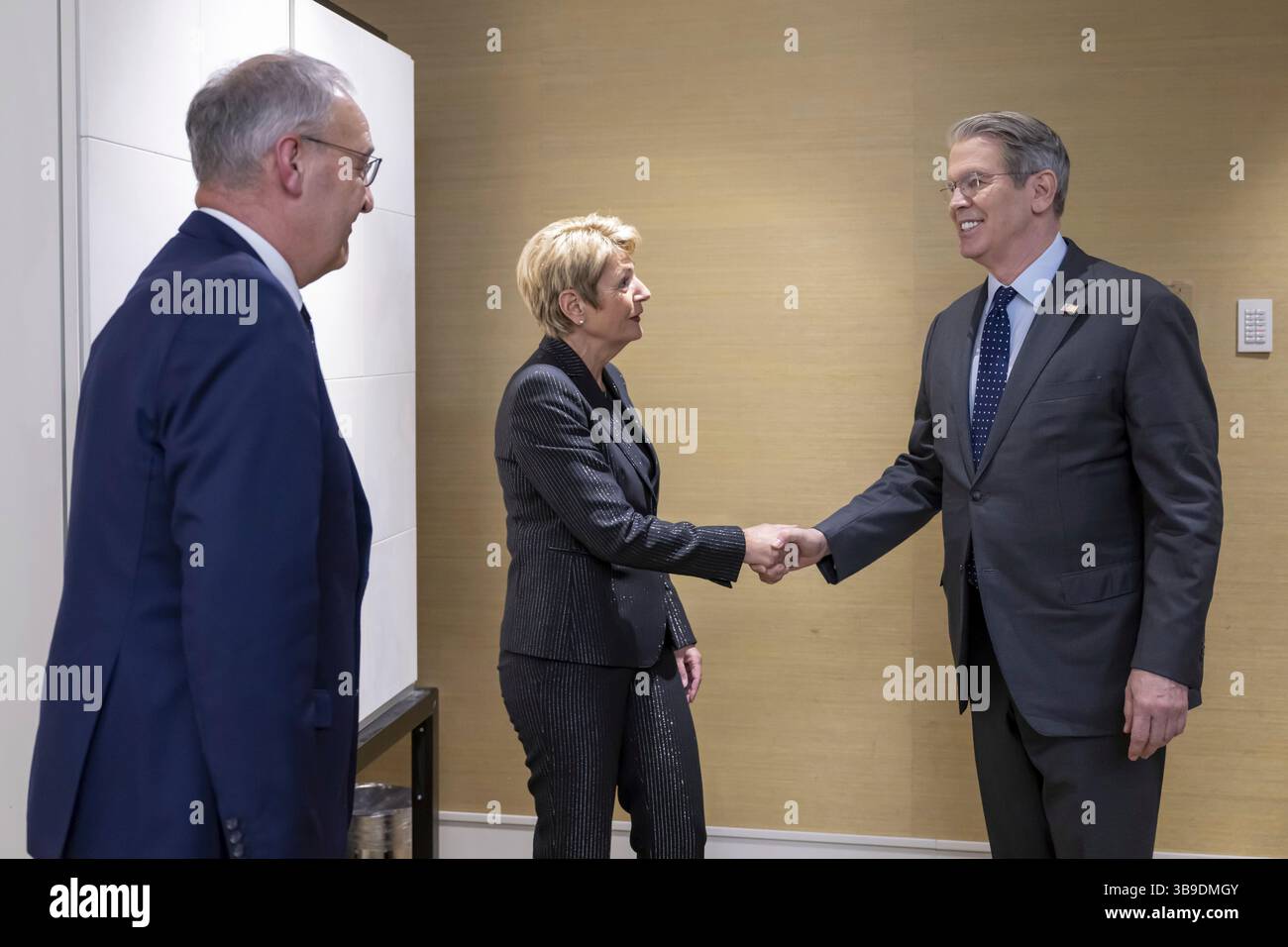 US Secretary of the Treasury Scott Bessent, right, shakes hands with Switzerland's President ...