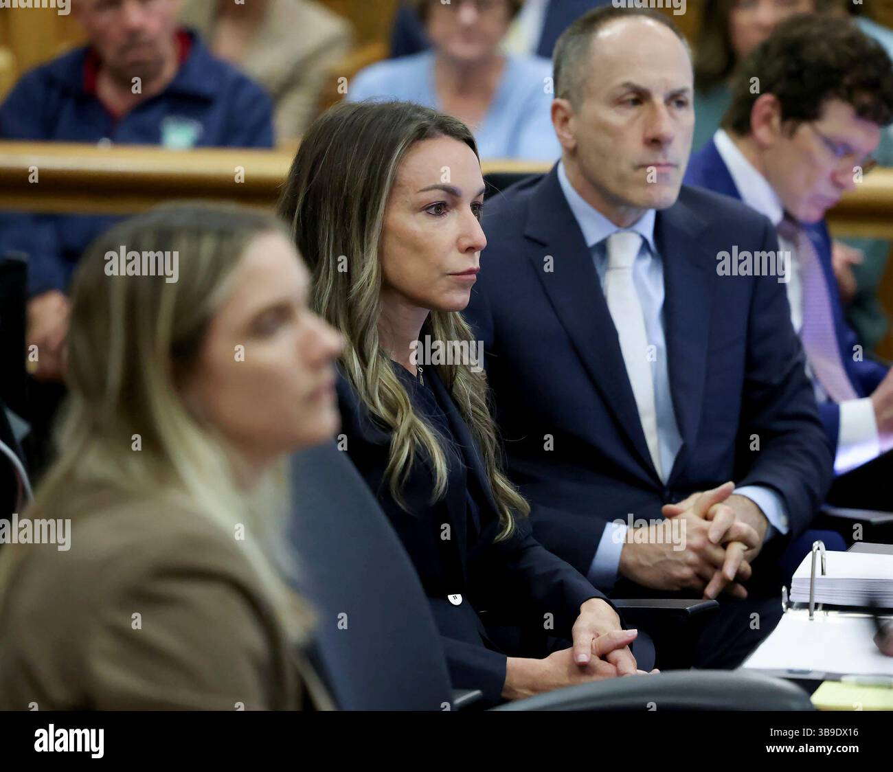 Defendant Karen Read, center, and defense lawyer David Yannetti, right ...