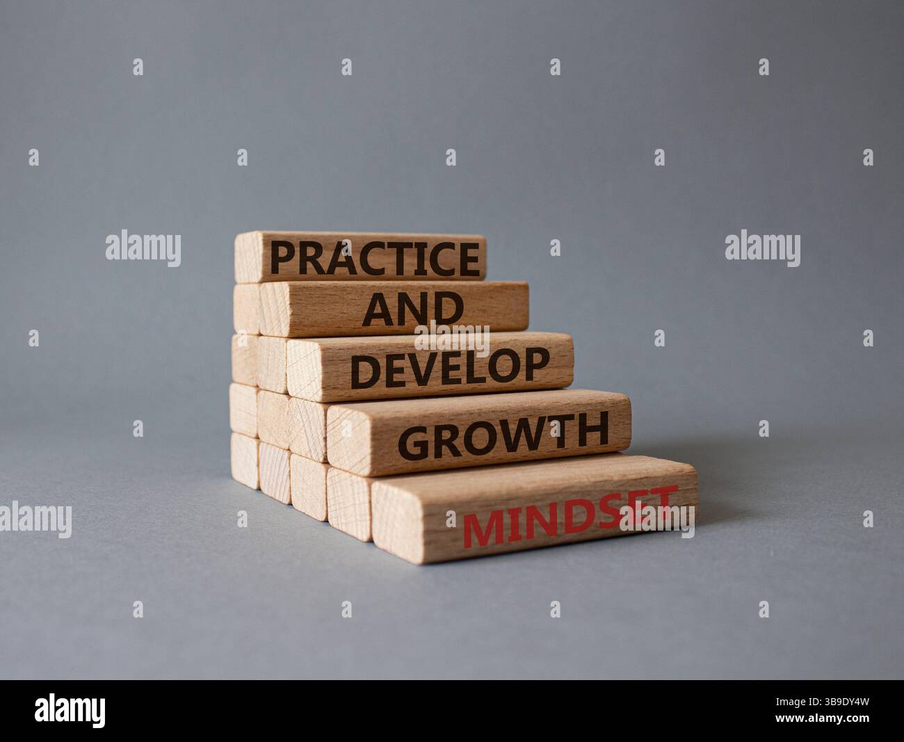 Practice and Develop growth mindset symbol. Wooden blocks with words ...