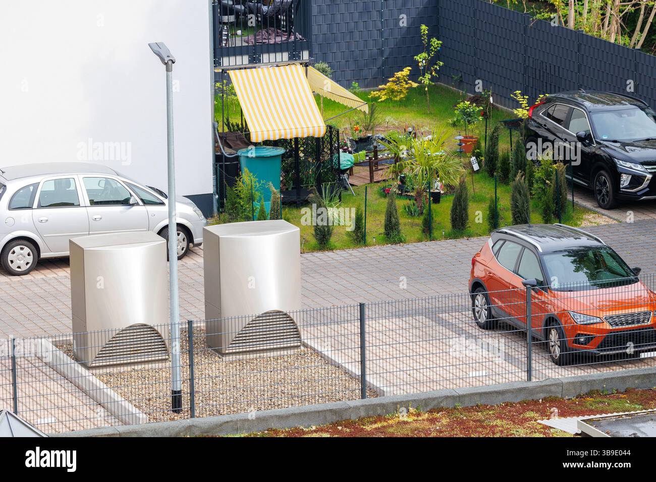Modern residential apartment building home yard with modern heat pumps ...