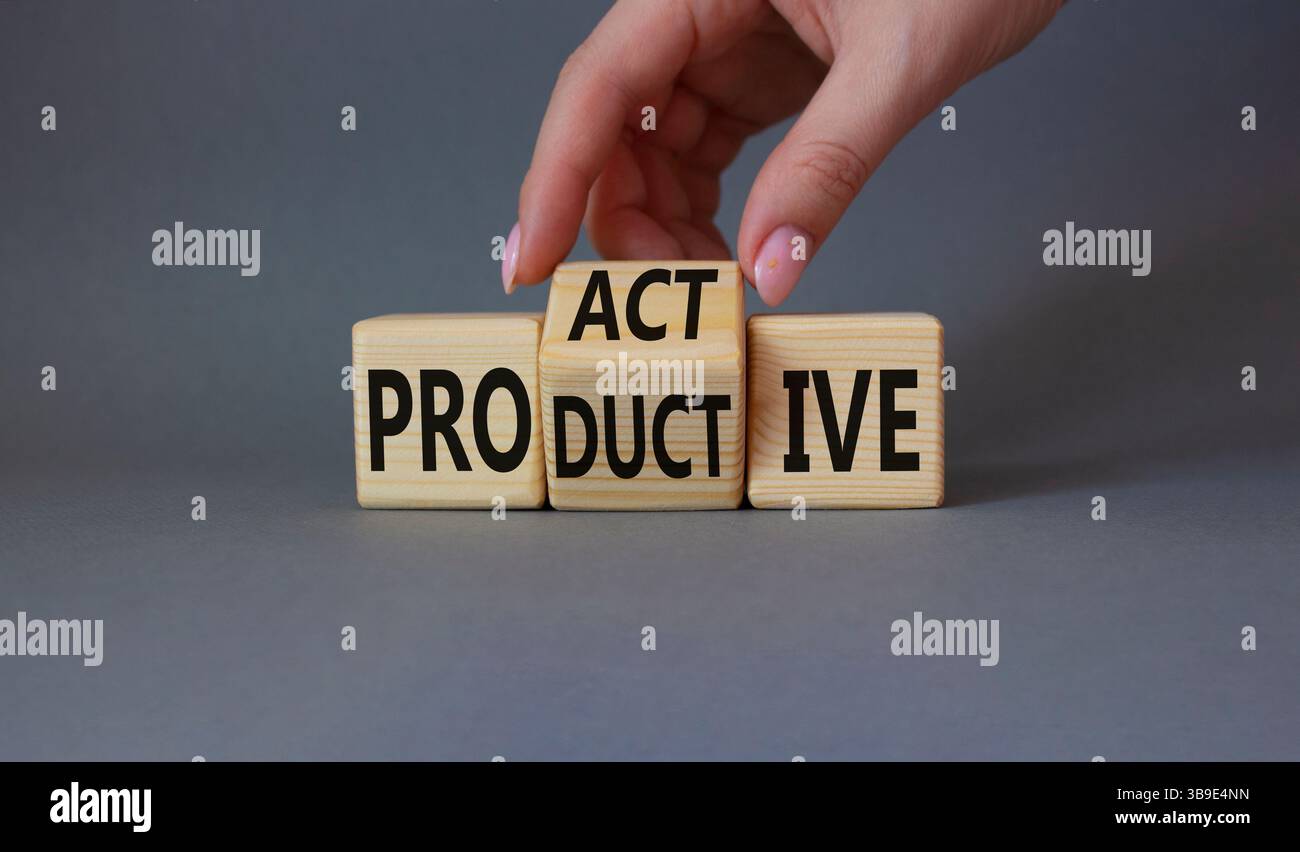 Proactive and Productive symbol. Businessman hand turns wooden cubes ...