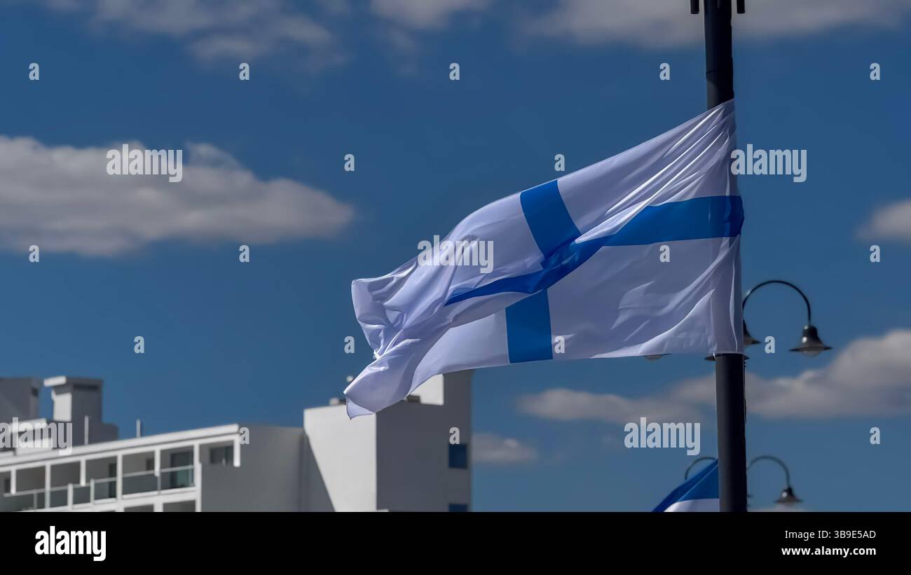 Flags of Cyprus and Greece flutter in the wind above modern white ...