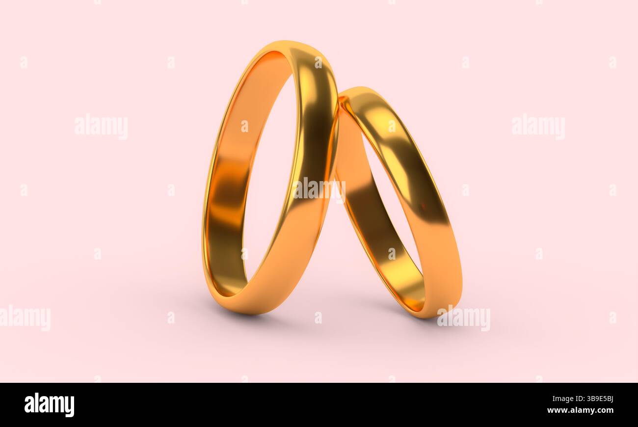 Two shiny golden wedding rings on pastel pink background Stock Photo ...