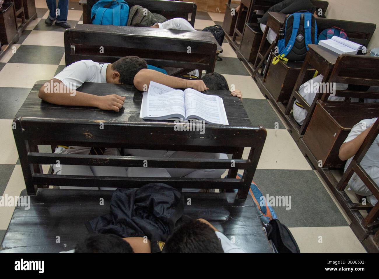 5/7/2025 Students practicing lying under the desk and benches during ...