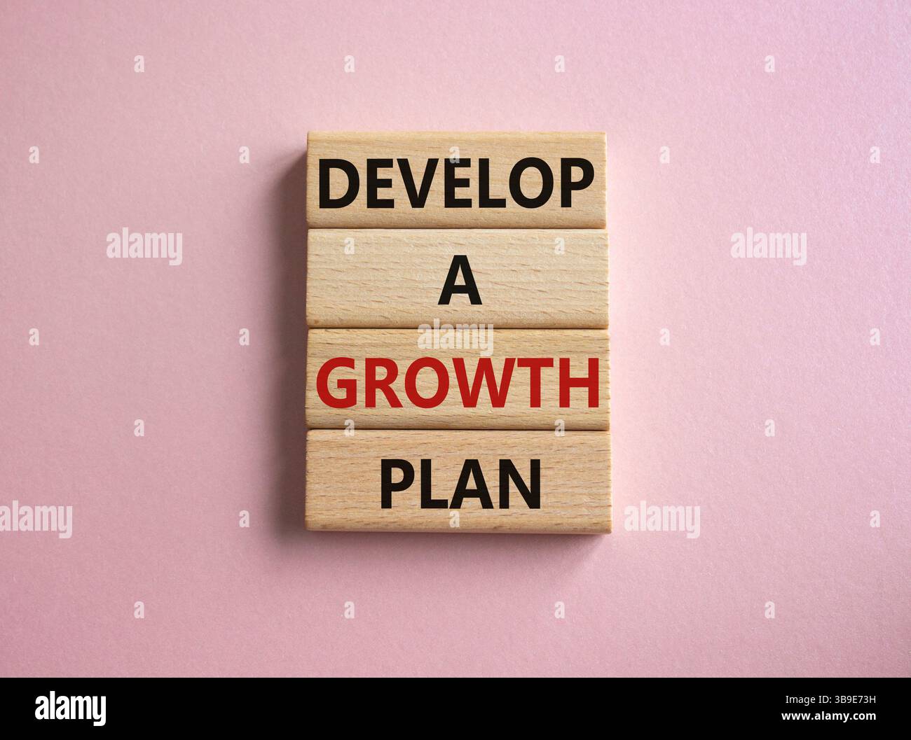 Develop a growth mindset symbol. Wooden blocks with words Develop a ...