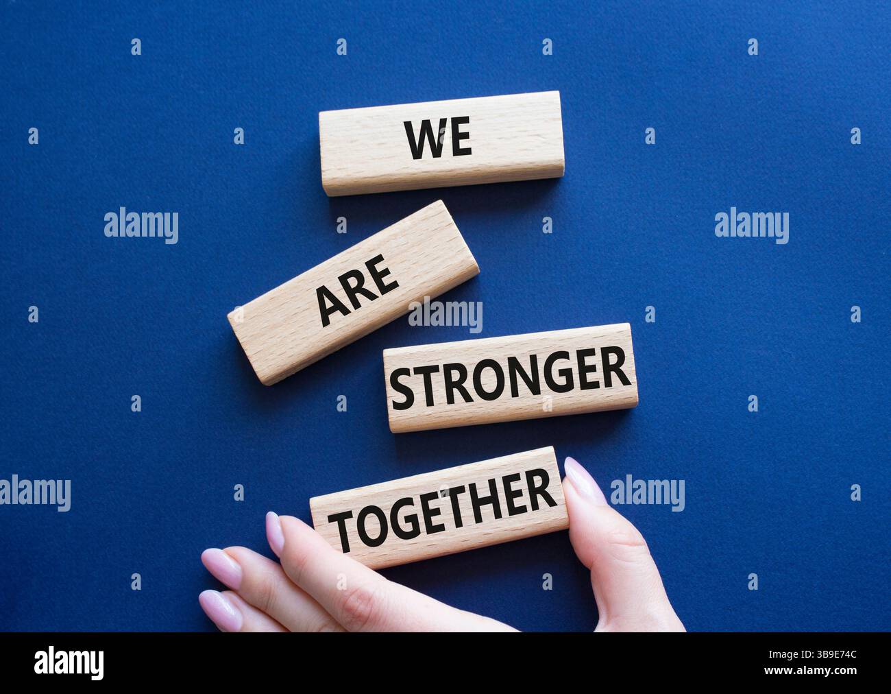 We are stronger together symbol. Wooden blocks with words We are ...