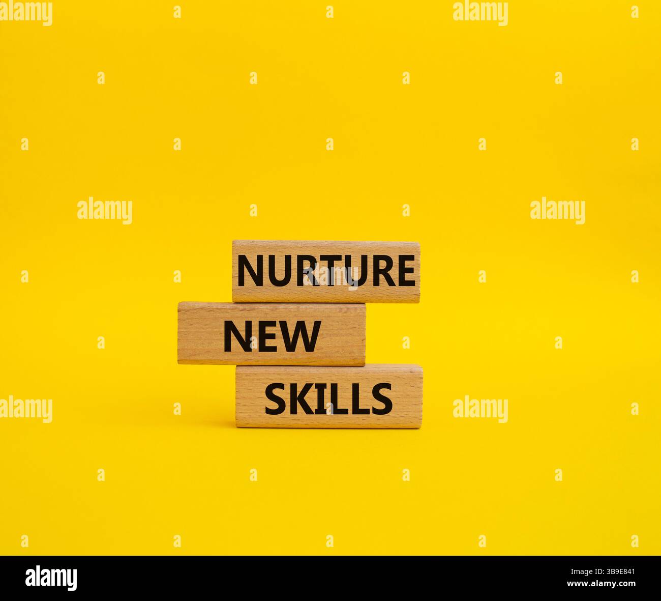 Nurture new skills symbol. Concept words Nurture new skills on wooden ...