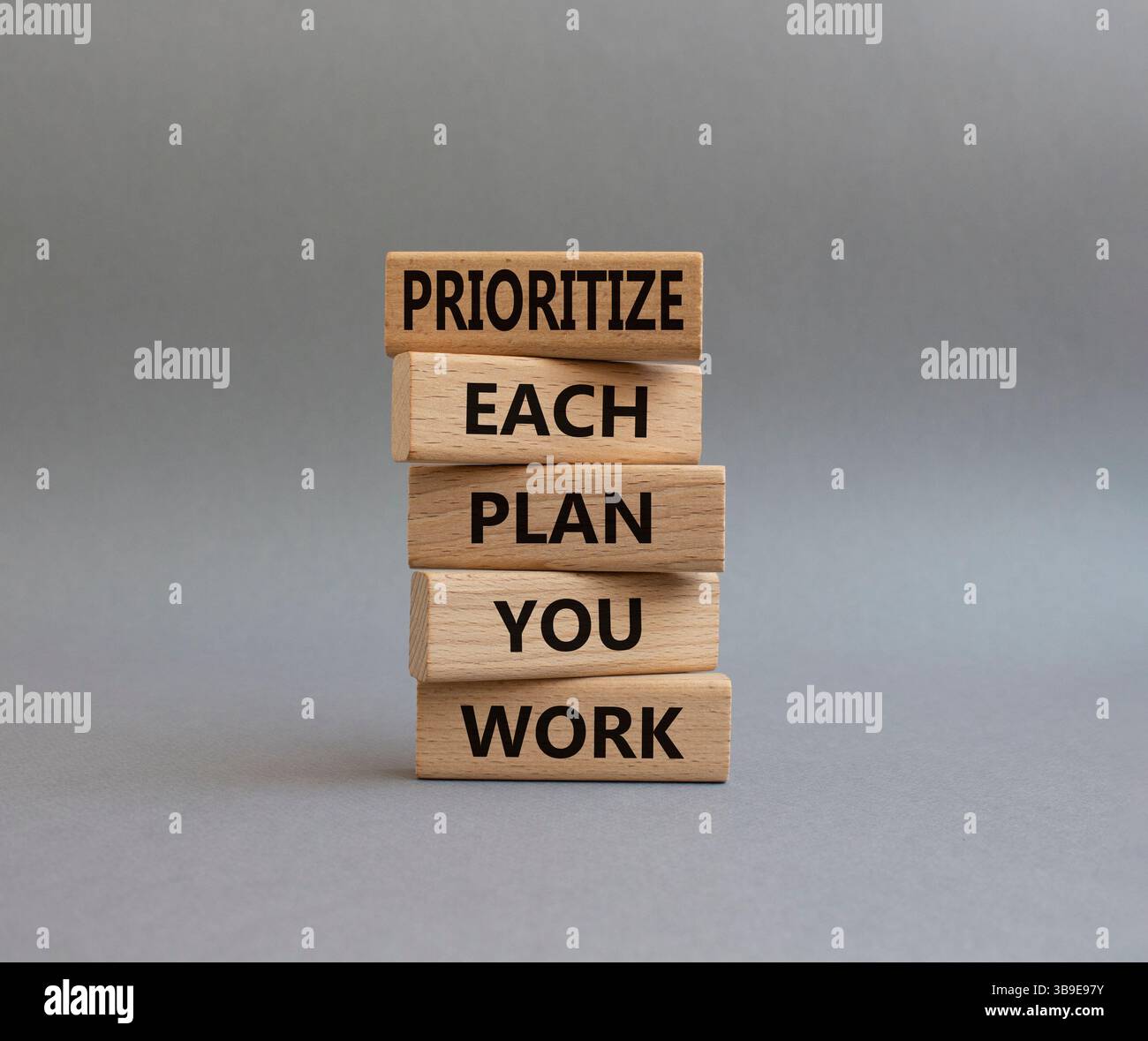 Priority, plan and work symbol. Wooden blocks with words Prioritize ...