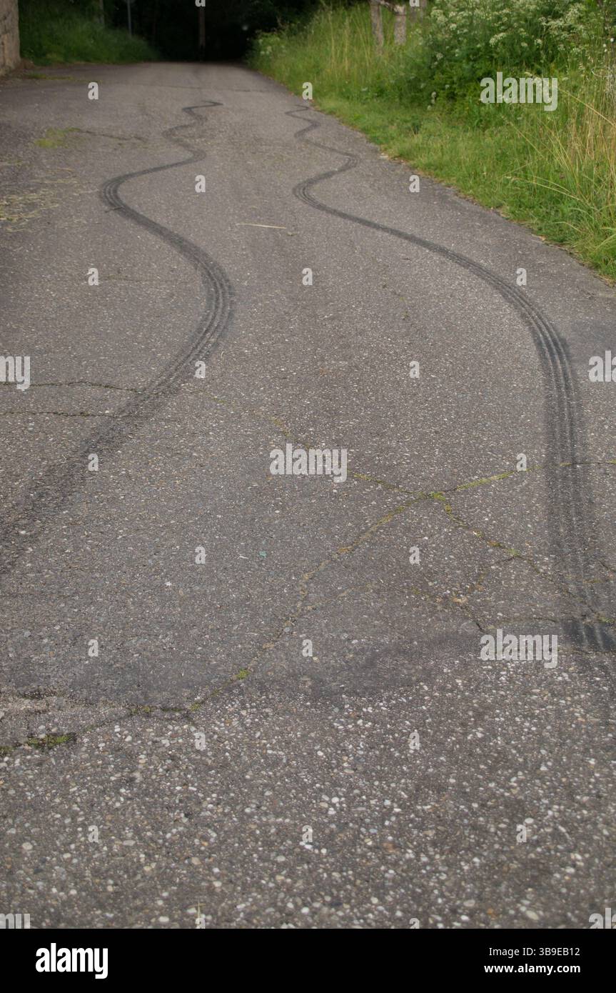 Photograph of a sudden stop on the road leaving a winding track Stock ...
