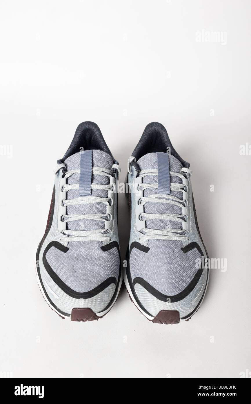 Close-up of a pair of modern running shoes, showcasing their design and ...