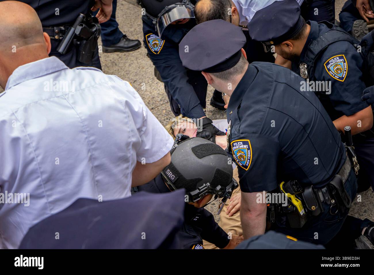 NEW YORK, NEW YORK - MAY 8: ??A ?protester? with a cast on their right ...