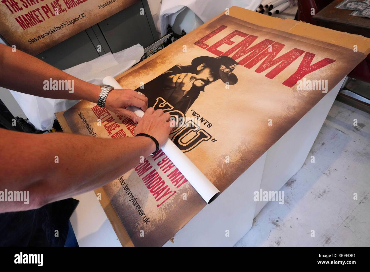 A man is preparing posters as Motorhead fans meet to commemorate Lemmy Kilmister the Motorhead ...