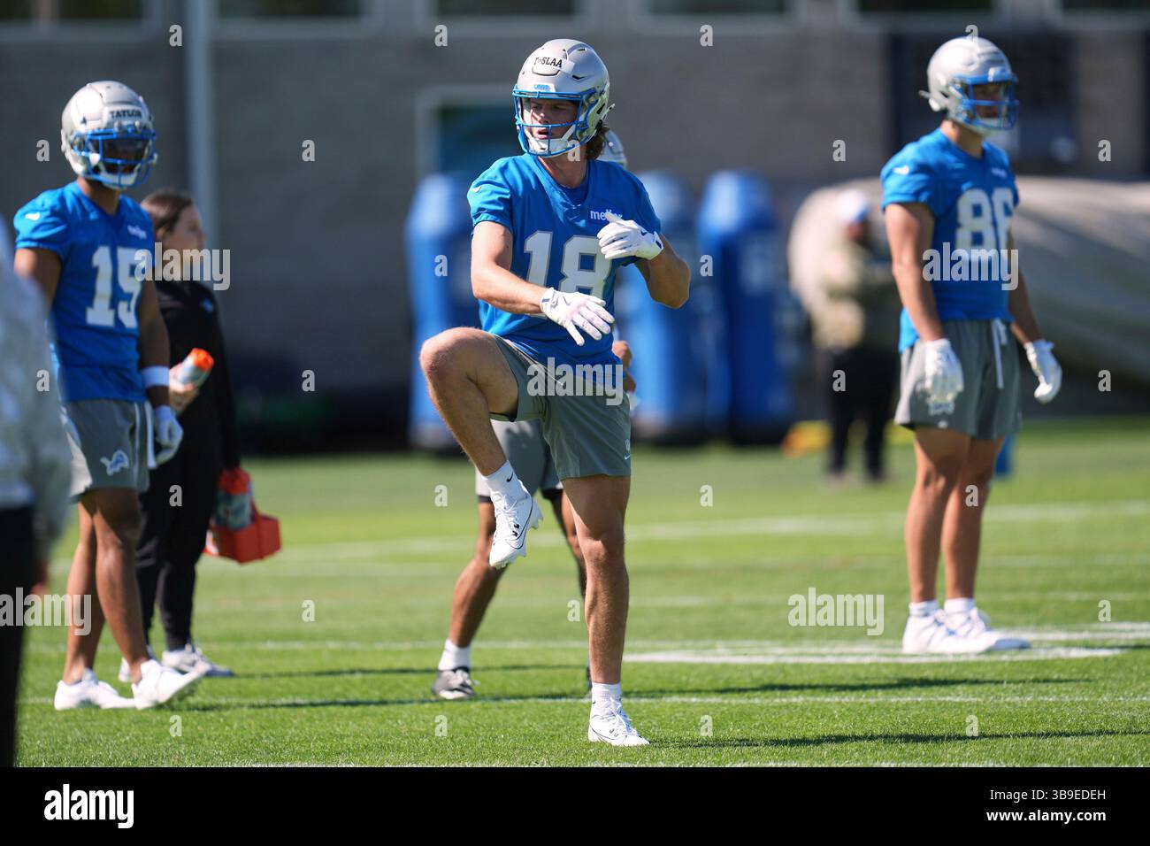 Detroit Lions wide receiver Isaac TeSlaa (18) stretches during the NFL ...