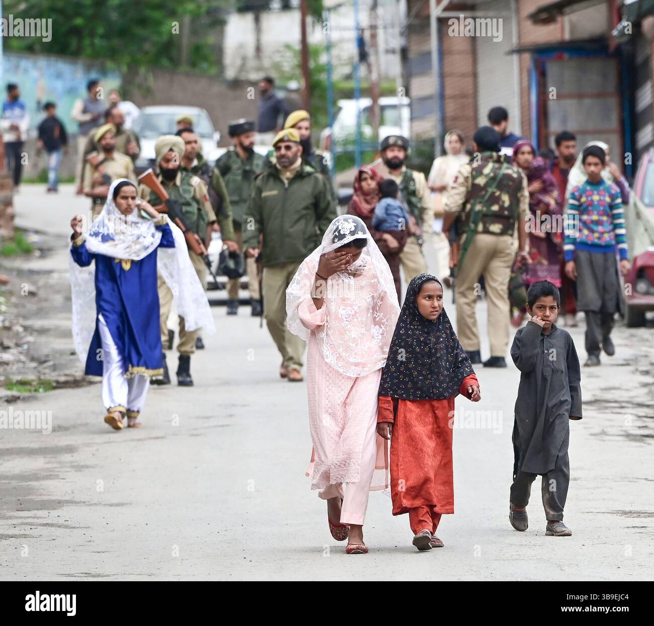 URI, INDIA - MAY 9: People leave their homes after overnight artillery ...