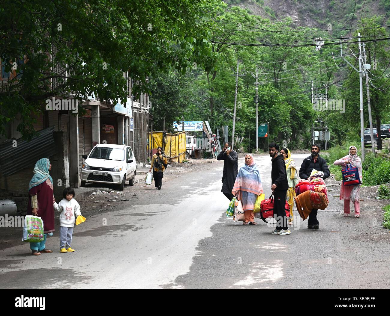 URI, INDIA - MAY 9: People leave after overnight artillery shelling by ...