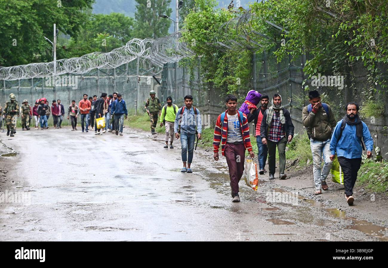 URI, INDIA - MAY 9: Labourers from outside state leave after overnight ...