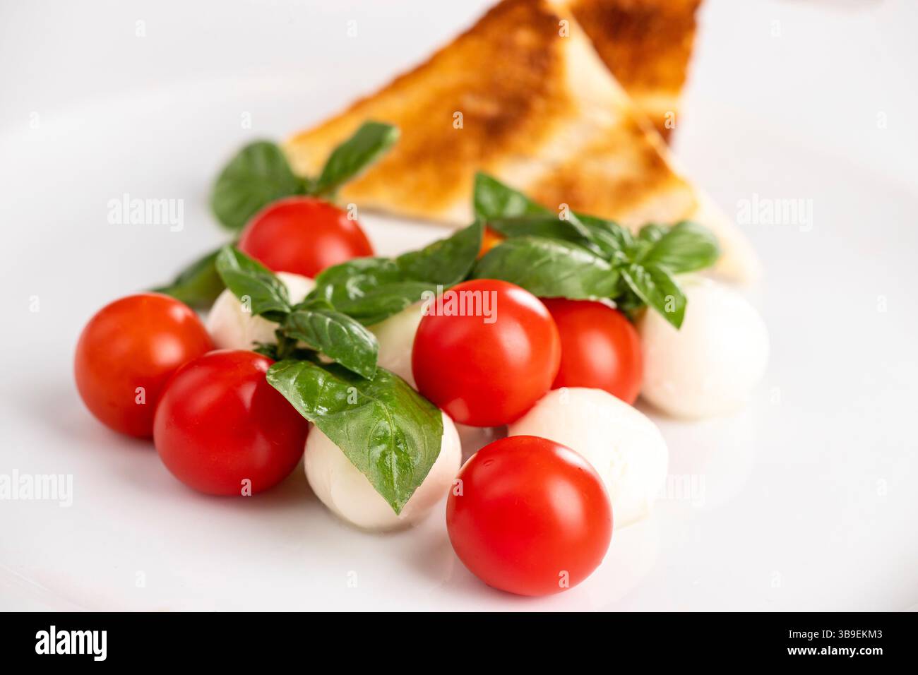 Italian insalada caprese on a white plate hi-res stock photography and ...