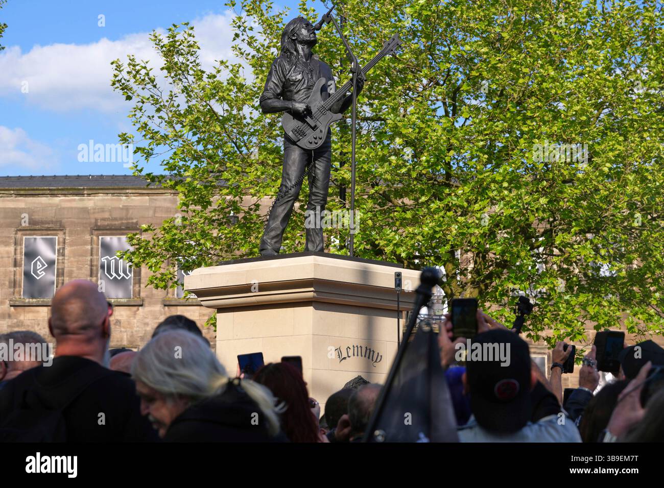 Motorhead fans take pictures of a statue to commemorate Lemmy Kilmister ...