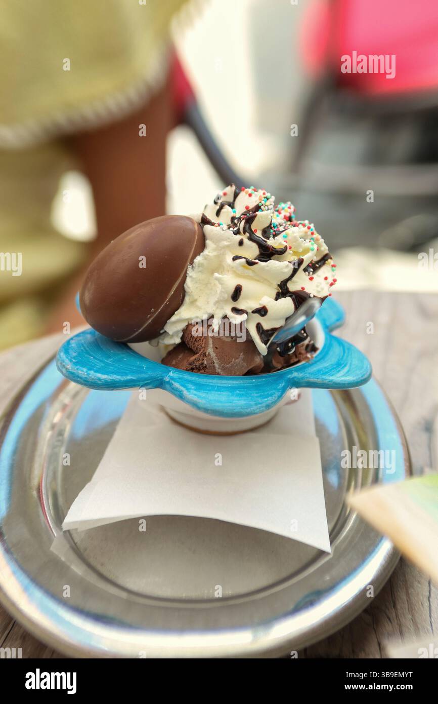 Delicious ice cream sundae with a surprise egg and whipped cream Stock ...