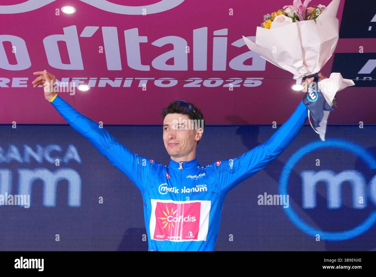 Sylvain Moniquet of Cofidis wears the blue jersey on the podium after ...
