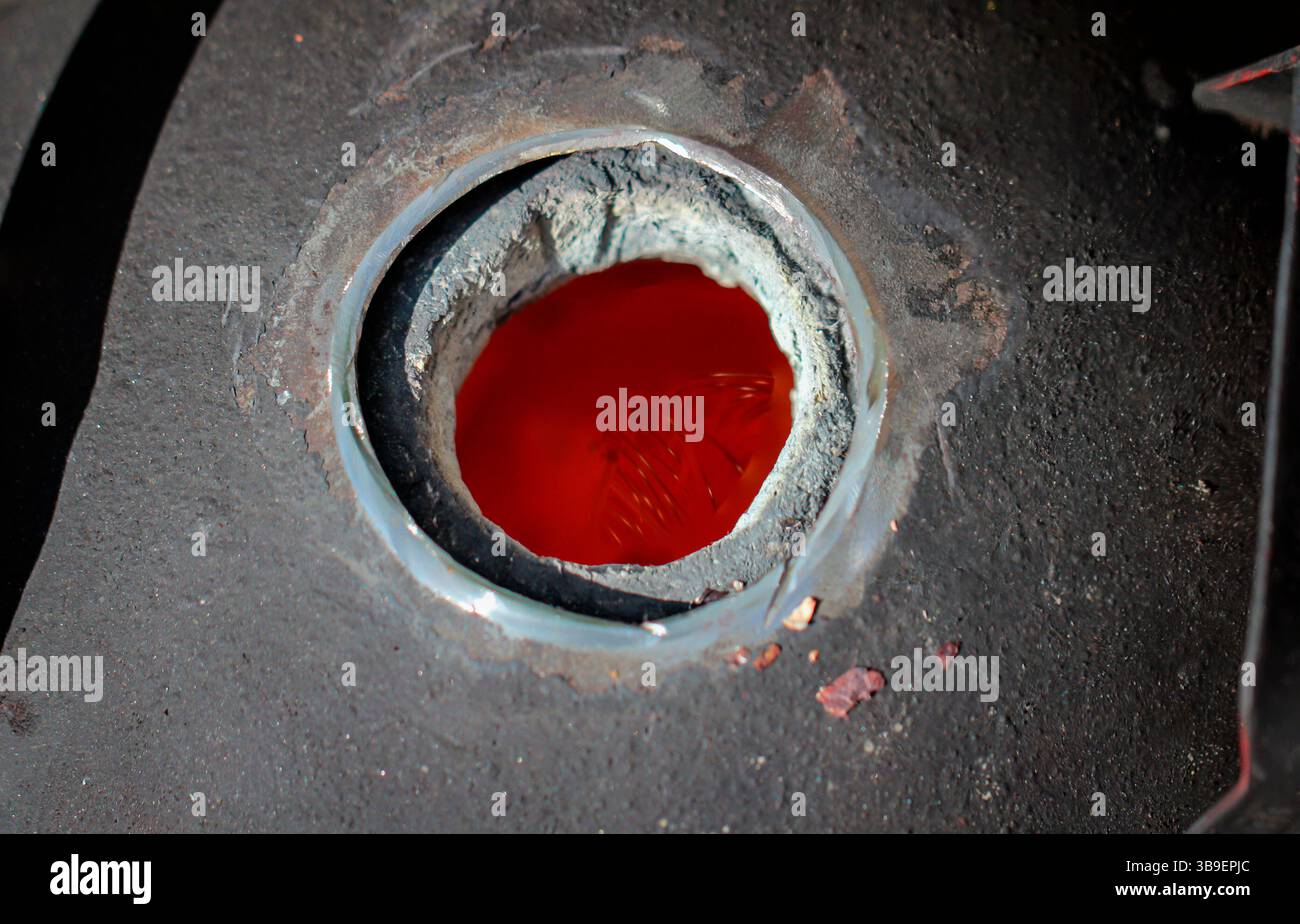 View into a bronze melting furnace Stock Photo - Alamy