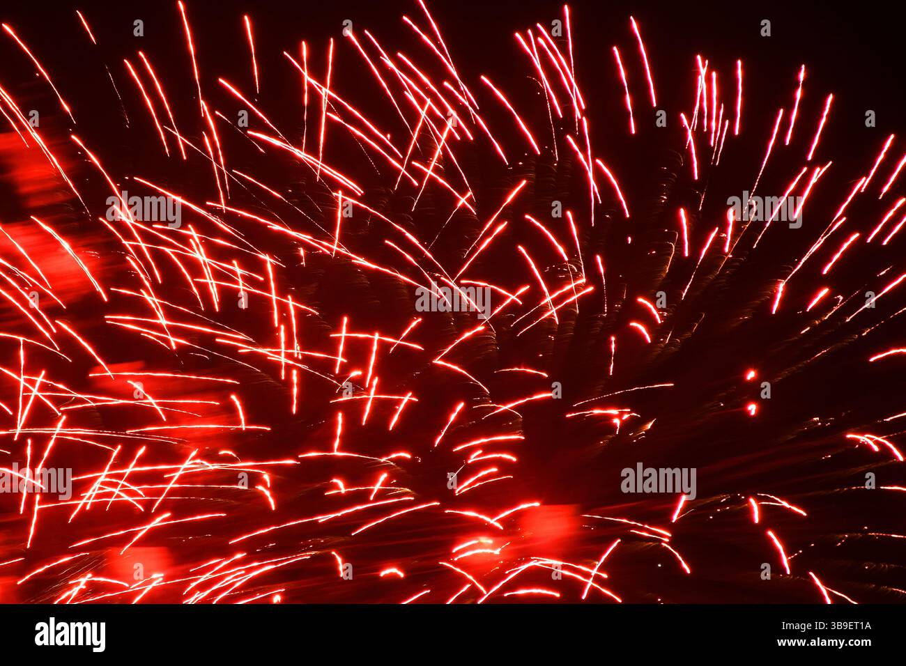 Fireworks, light trails in red Stock Photo - Alamy