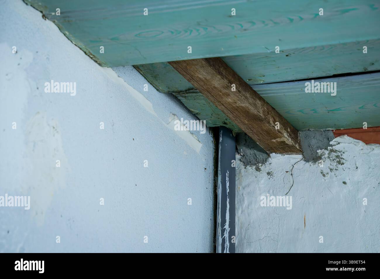 Unfinished turquoise wood ceiling with beam and corner pipe Stock Photo ...