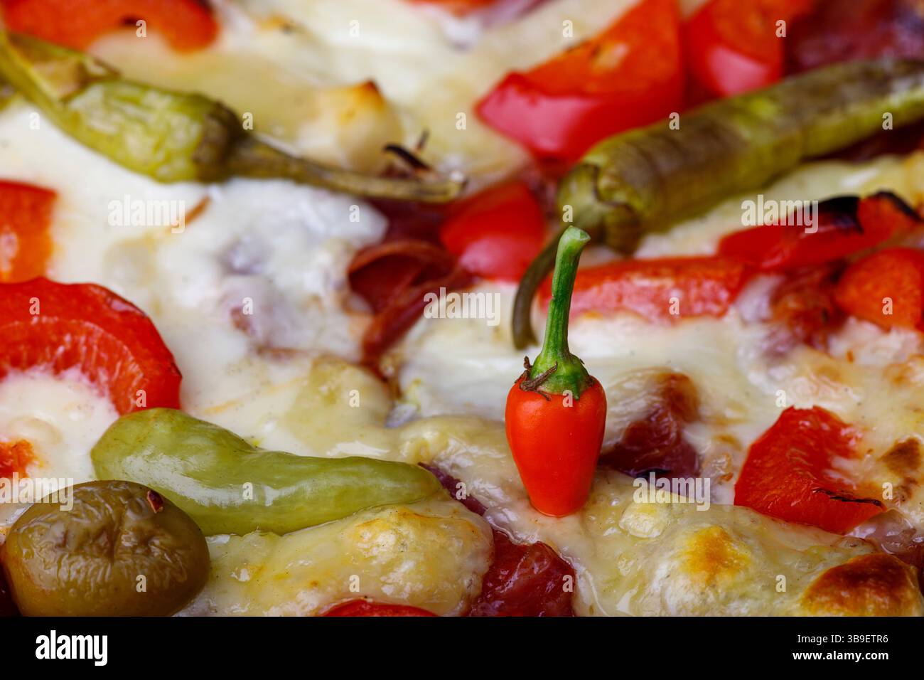 Red chilli on a delicious pizza Stock Photo - Alamy