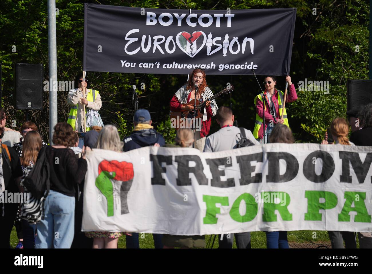 People attend a pro-Palestine mini-concert outside the RTE in Dublin ...