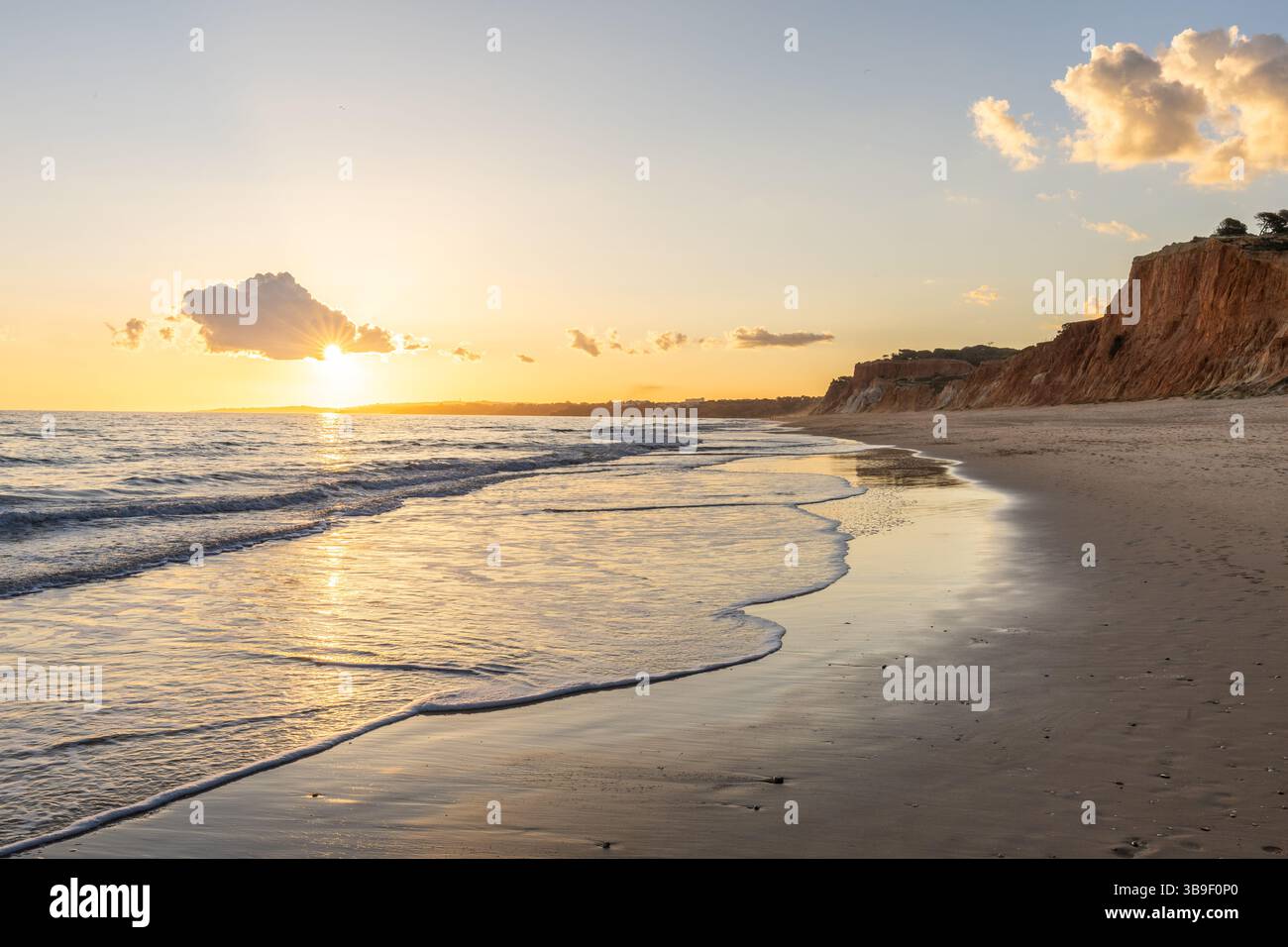 The golden sandy beach of Praia da Falésia with its characteristic ...