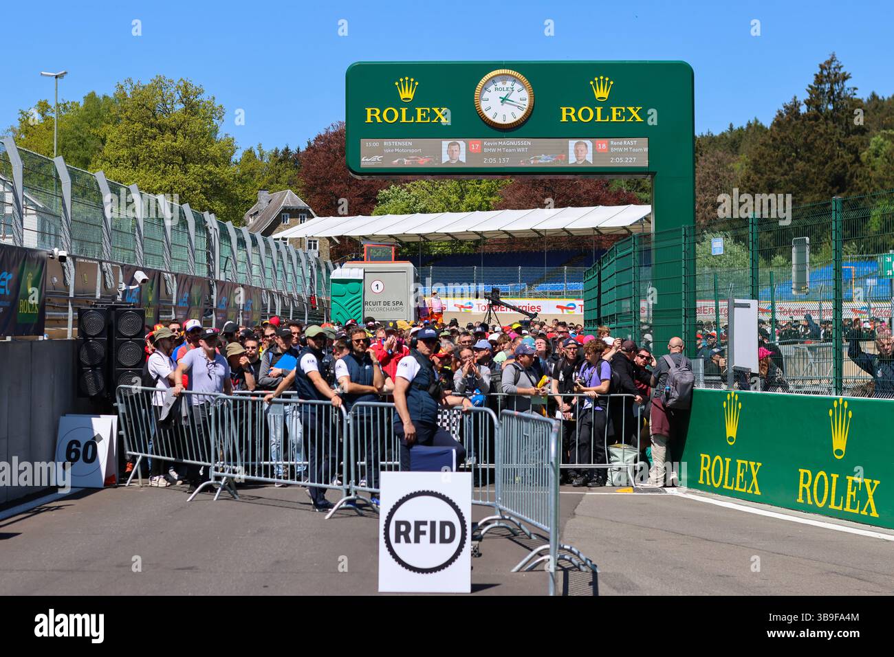 Large crowds of fans queue at the pit lane exit ahead of the Pit Walk ...