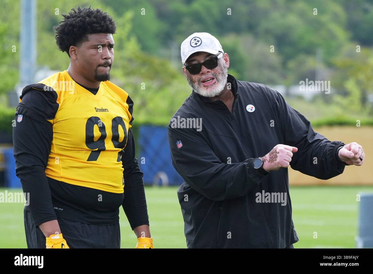 Pittsburgh Steelers first round draft pick Derrick Harmon (99) listens ...