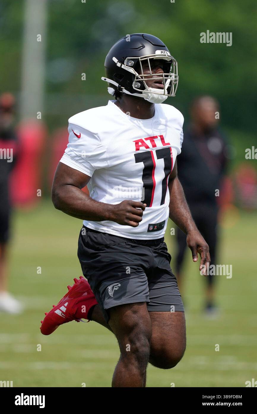 Atlanta Falcons edge rusher Jalon Walker (11) runs drills during the ...