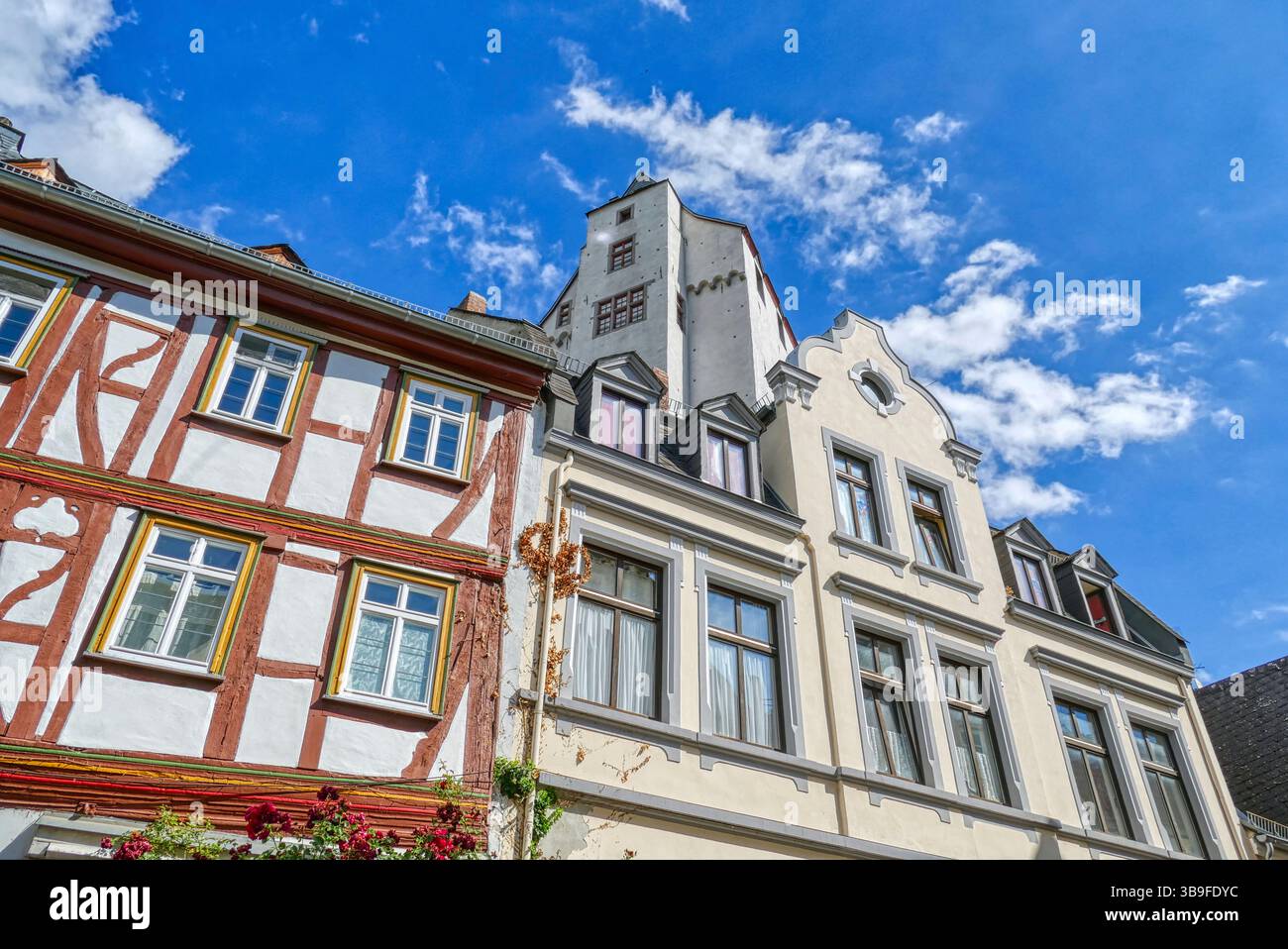 Historic half-timbered house and count's castle in Diez Stock Photo - Alamy