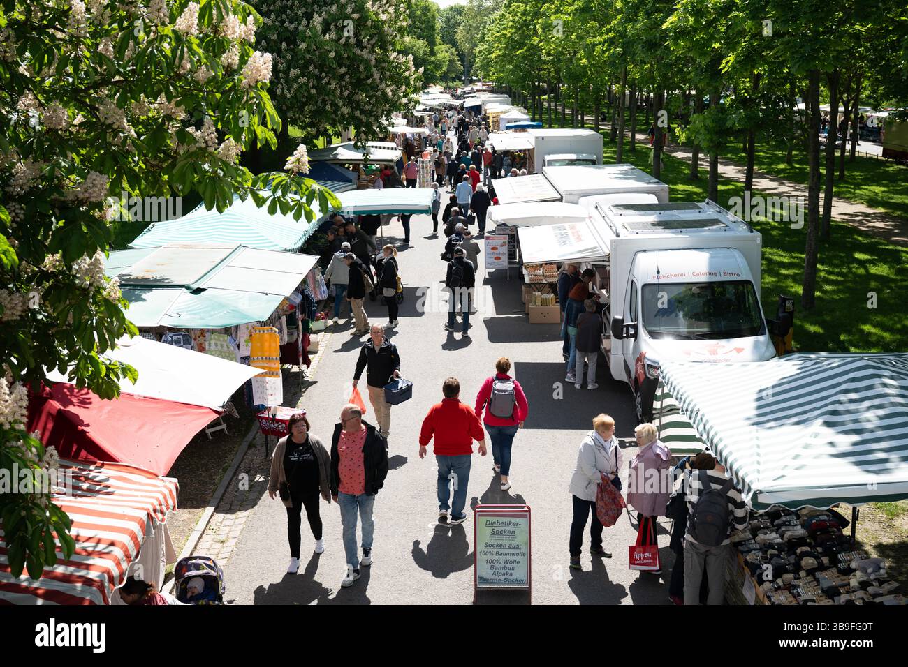 Dresden, Germany. 09th May, 2025. People walk between stalls at Lingnermarkt. Credit: Sebastian ...