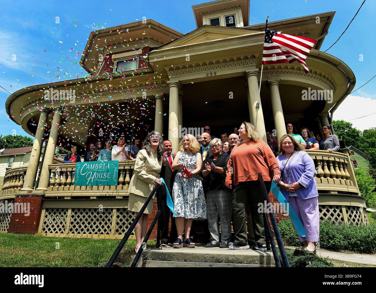 Women's Help Center Executive Director Roxann Tyger, center, is joined ...